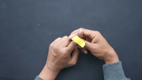 blue color adhesive bandage on hand | Stock Video | Pond5