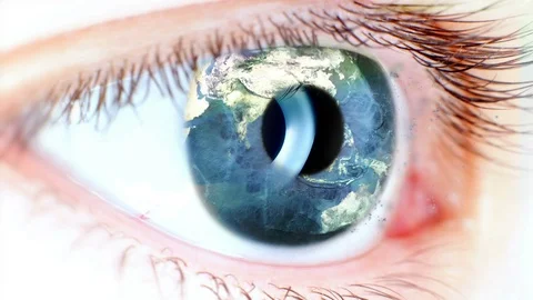 Blue eye with Earth map on iris and part... | Stock Video | Pond5