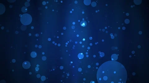 Blue glitter particles falling on dark b... | Stock Video | Pond5
