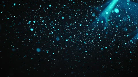 Blue glitter particles falling in light ... | Stock Video | Pond5