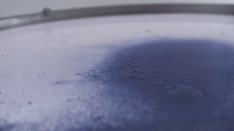 Blue holi powder bounces off drum in sho... | Stock Video | Pond5
