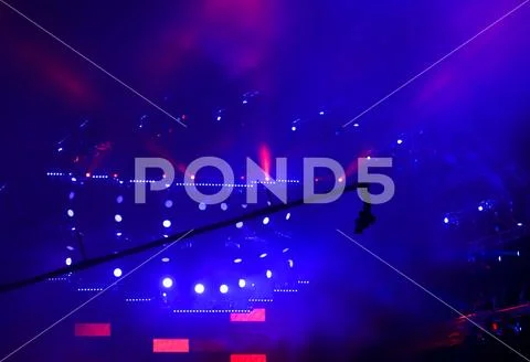 Photograph: Blue light on a rock concert stage as background #118510632