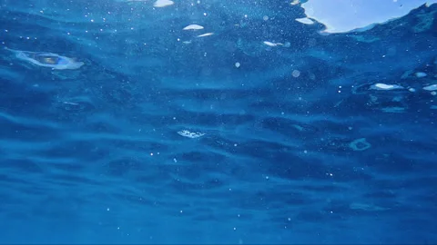 Blue Ocean waves shimmer on the surface ... | Stock Video | Pond5