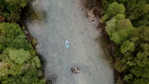 Blue raft floating down a very scenic ri... | Stock Video | Pond5