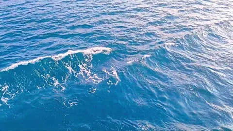 blue sea water with small waves due to s... | Stock Video | Pond5