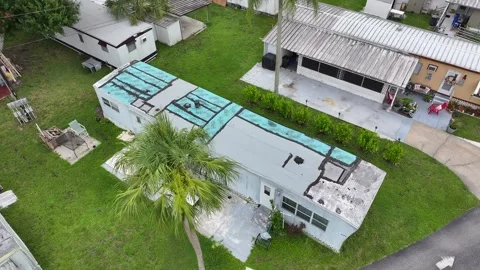 Blue tarp on mobile home, double wide ro... | Stock Video | Pond5