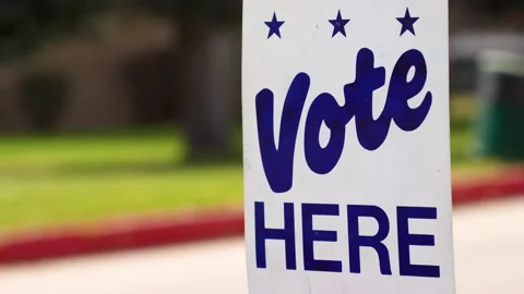 Blue Vote Here Sign Close up with People... | Stock Video | Pond5