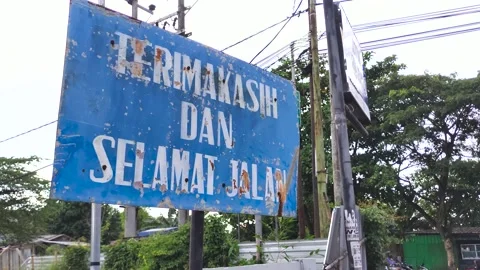 blue warning sign with peeling paint | Stock Video | Pond5