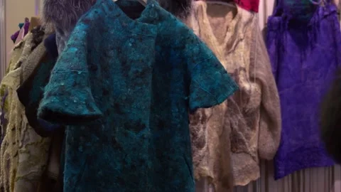 Blue wool coat hanging in the wardrobe. | Stock Video | Pond5