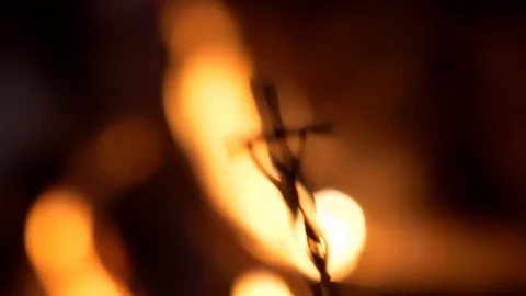 Blurred Crucifix Silhouette on Fire Flam... | Stock Video | Pond5