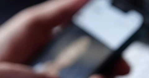 Blurred footage of a person scrolling th... | Stock Video | Pond5
