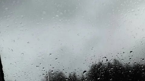 Blurred window with falling rain drops. ... | Stock Video | Pond5