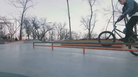 bmx rider doing tricks in concrete skate... | Stock Video | Pond5