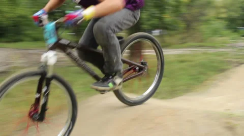 BMX rider in helmet spinning wheels on c... | Stock Video | Pond5