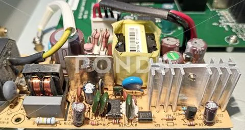 Photograph: Board of capacitors, transformers, microcircuits of ...