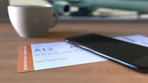 Boarding pass to Kuwait City and smartph... | Stock Video | Pond5