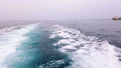 Boat moving in the sea splashing water b... | Stock Video | Pond5