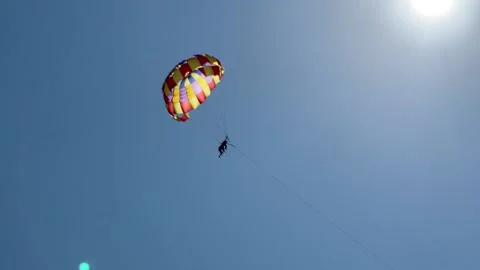 boat pull parachute with children on rop... | Stock Video | Pond5