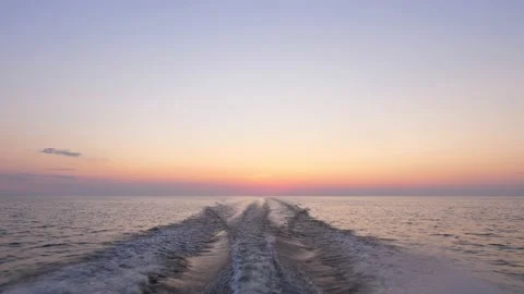 Boat rush at calm lake, camera look back... | Stock Video | Pond5