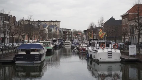 Boats docked in a city channel. These bo... | Stock Video | Pond5