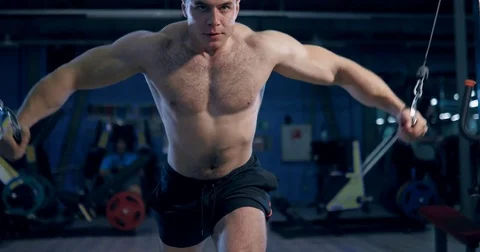 bodybuilder doing exercise on the simula... | Stock Video | Pond5