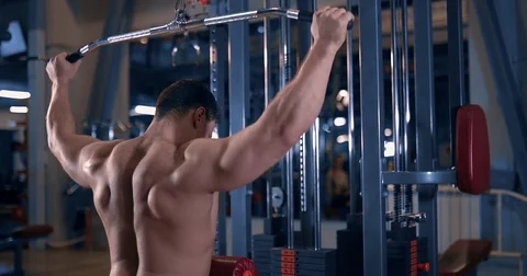 bodybuilder doing exercise on the simula... | Stock Video | Pond5