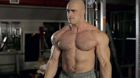 bodybuilder exercising biceps at gym | Stock Video | Pond5