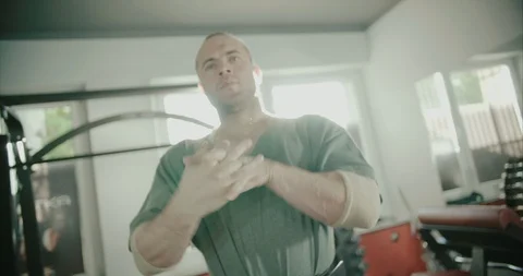Bodybuilder is flexing his hand muscles ... | Stock Video | Pond5