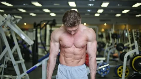 bodybuilder poses demonstrating tense mu... | Stock Video | Pond5