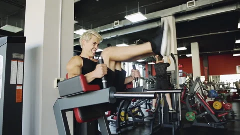 Bodybuilder raises his legs up, exercise... | Stock Video | Pond5