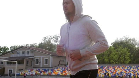 Bodybuilder running and jogging on the f... | Stock Video | Pond5