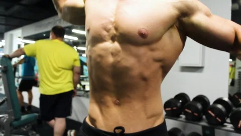 bodybuilder shows muscle on body | Stock Video | Pond5