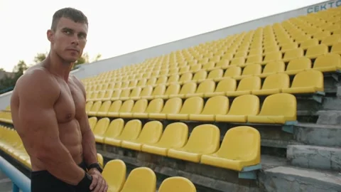 A bodybuilder training at the city stadi... | Stock Video | Pond5