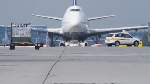 Boeing 747 Jumbo Aircraft pulled by push... | Stock Video | Pond5