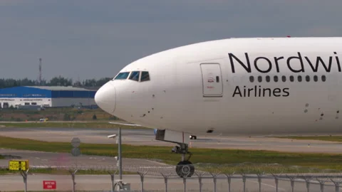 Boeing 777 of Nordwind, side view | Stock Video | Pond5