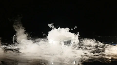 Boiling dry ice in a water with dense va... | Stock Video | Pond5