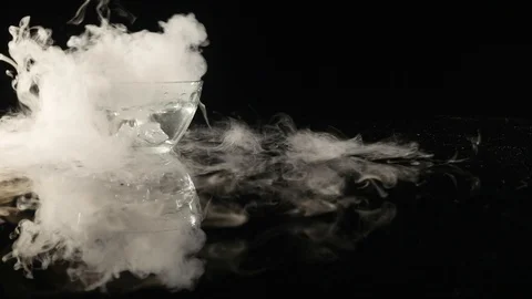 Boiling dry ice in a water with dense va... | Stock Video | Pond5