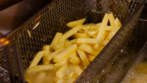 Boiling french fries potato chips in the... | Stock Video | Pond5