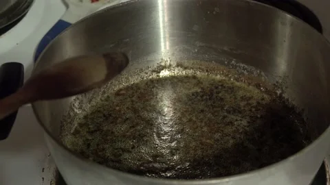 Boiling pot of bubbling green-brown liqu... | Stock Video | Pond5