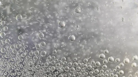 Boiling water. Air bubbles float in a li... | Stock Video | Pond5