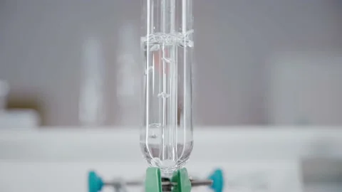 Boiling water in a glass flask. Bubbles.... | Stock Video | Pond5