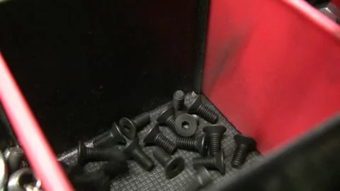 Bolts spill into the organizer. Bolt sho... | Stock Video | Pond5