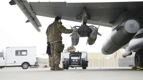 Bomb loader being positioned under wing ... | Stock Video | Pond5