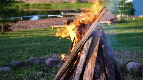 bonfire, burn a log in the afternoon on ... | Stock Video | Pond5