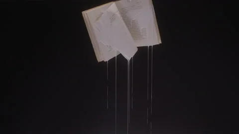 Book Dripping White Paint in a Studio wi... | Stock Video | Pond5