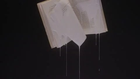 Book Dripping White Paint in a Studio wi... | Stock Video | Pond5
