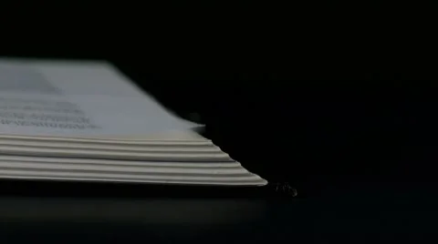 book page turning on black background 4k... | Stock Video | Pond5