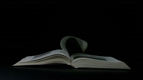 book page turning on black background 4k... | Stock Video | Pond5