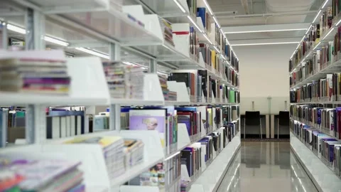 Books on bookshelves in modern universit... | Stock Video | Pond5