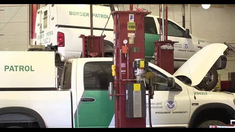 Border Patrol vehicles inside maintenanc... | Stock Video | Pond5